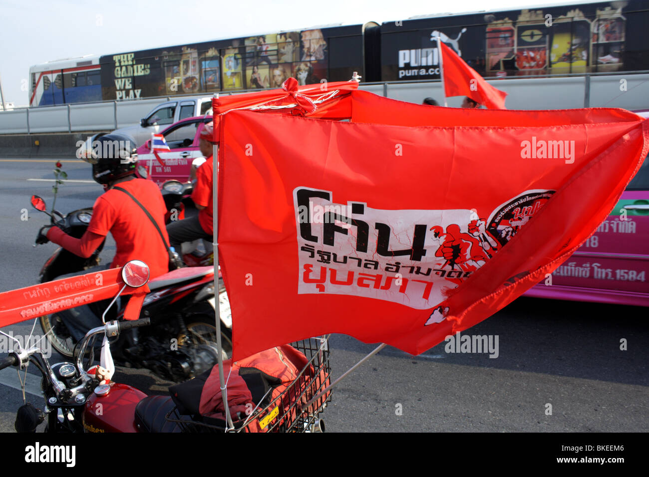Red-shirted supporters of deposed Thai premier Thaksin Shinawatra wave ...