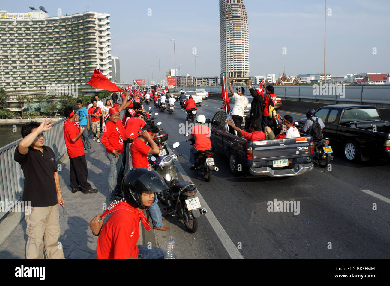Red-shirted supporters of deposed Thai premier Thaksin Shinawatra wave ...