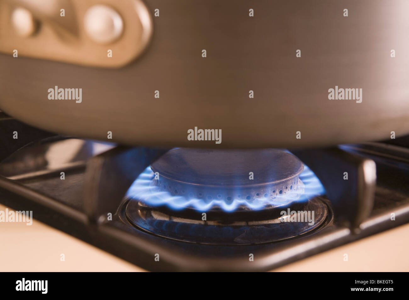 Pot On A Gas Stove Top With Blue Flame Stock Photo - Alamy