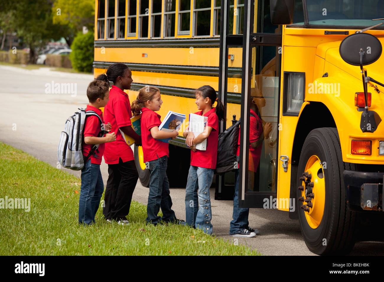 Children talking school bus hi-res stock photography and images - Alamy