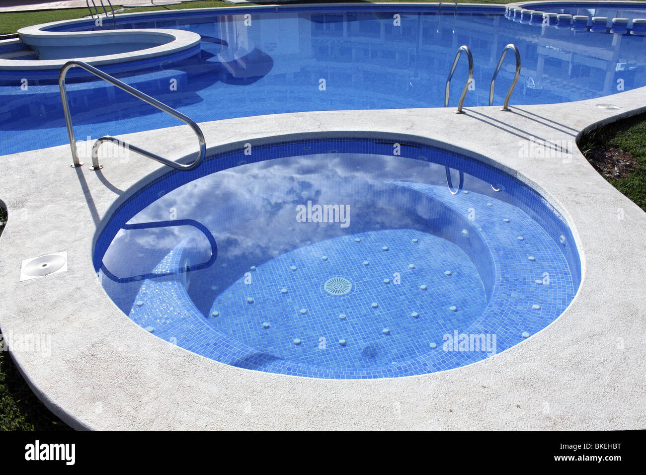 blue swimming pool round shapes and outdoor jacuzzi Stock Photo - Alamy