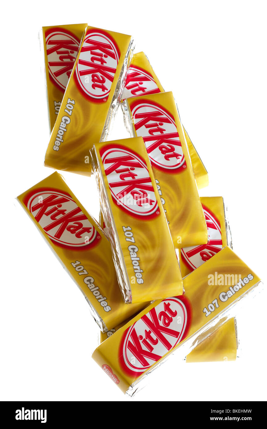 Pile of individual two finger packs of caramel flavoured Nestle KitKat ...