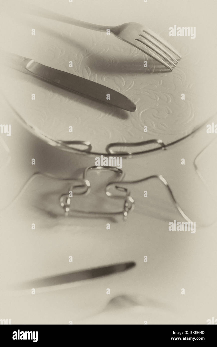 Reflection of a knife and plug in a mirror Stock Photo - Alamy