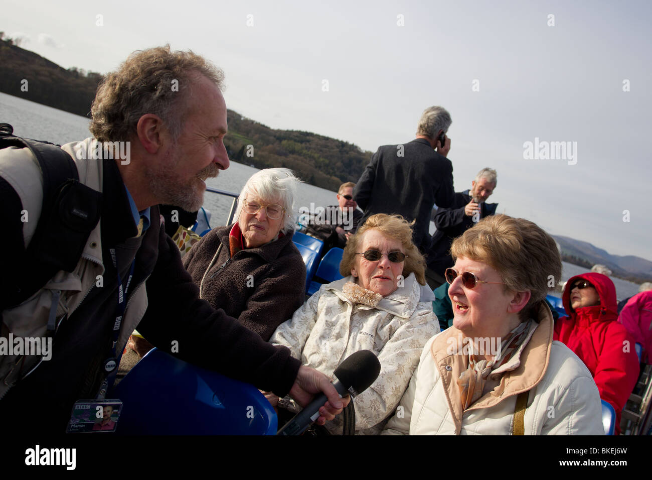 BBC Radio Cumbria Martin Lewes interviewing microphone mic reporter ...