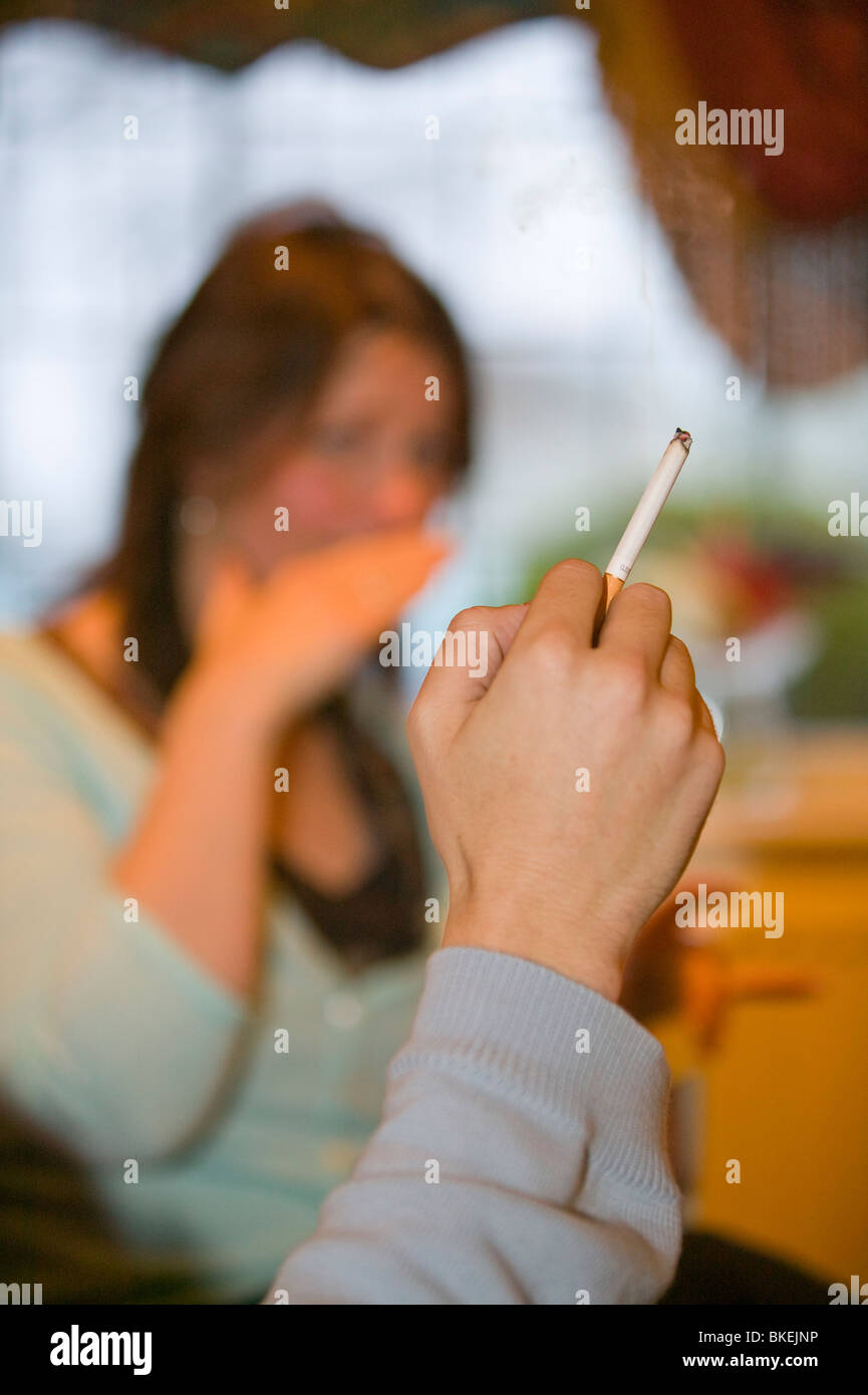 A woman objecting to a smoker Stock Photo - Alamy
