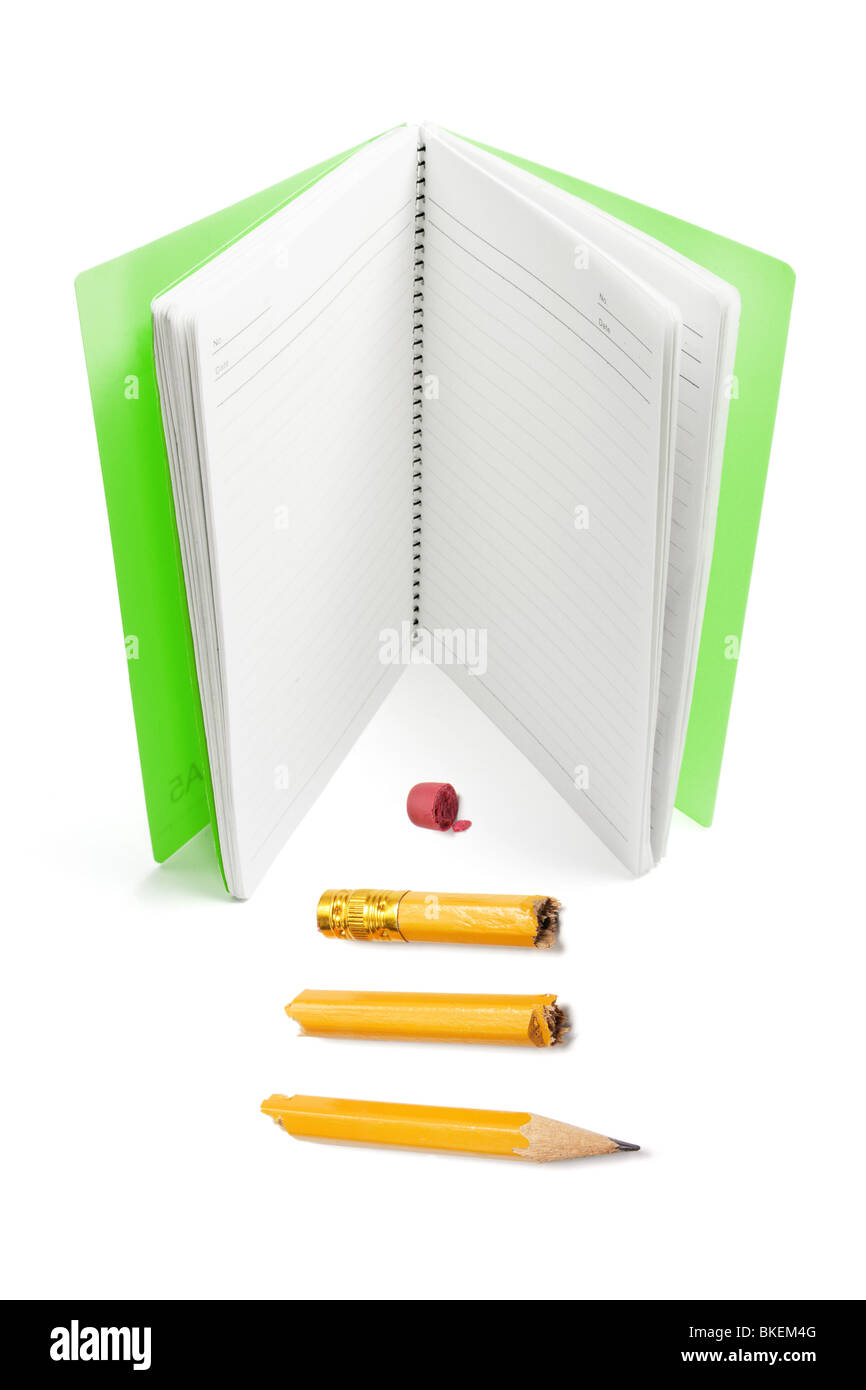 Note Book and Broken Pencil Pieces Stock Photo - Alamy