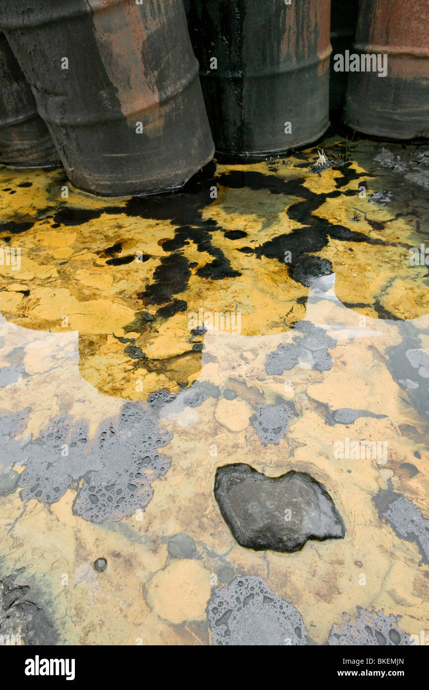 Abandoned barrels of leaking waste oil on the tundra at Nome in Alaska ...
