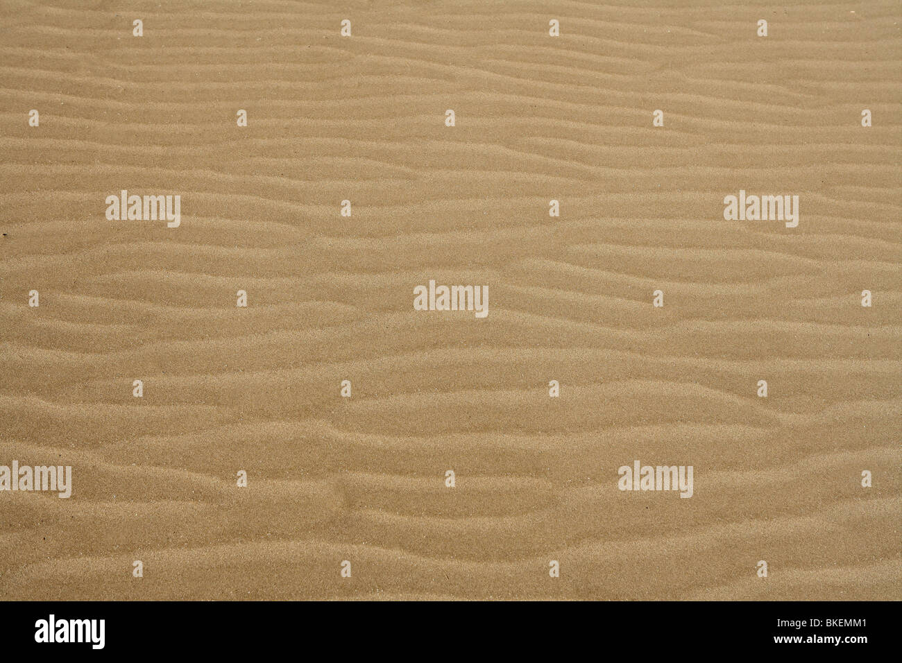 Beach sand waves warm texture pattern background Stock Photo - Alamy