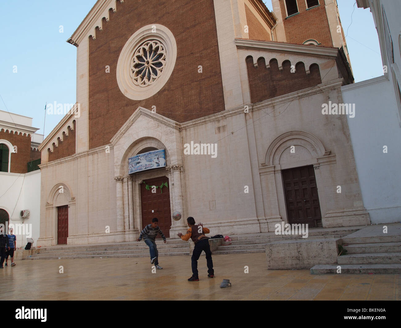 Boys playing football outside the Catholic Church, Tripoli, Libya Stock ...