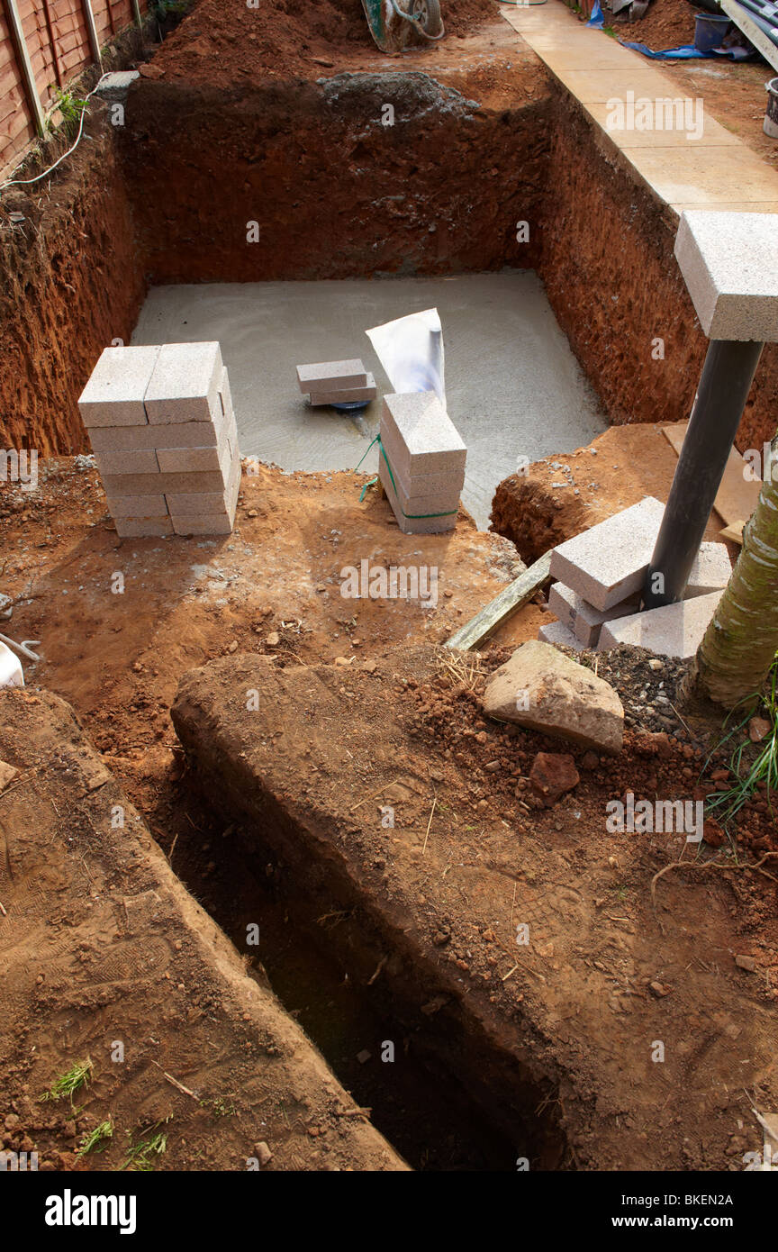 Koi pond construction Stock Photo - Alamy