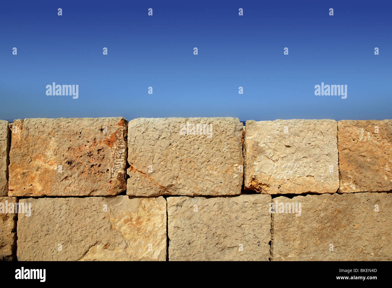 Big stone bricks masonry wall on port dock under blue sky Stock Photo ...