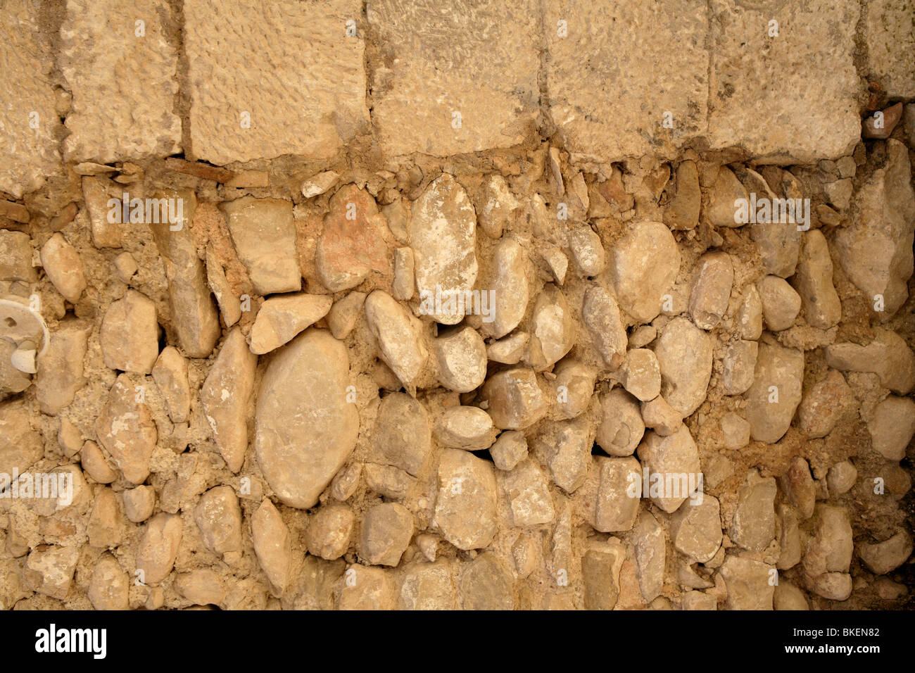 Golden masonry stone wall from old building construction facade Stock ...