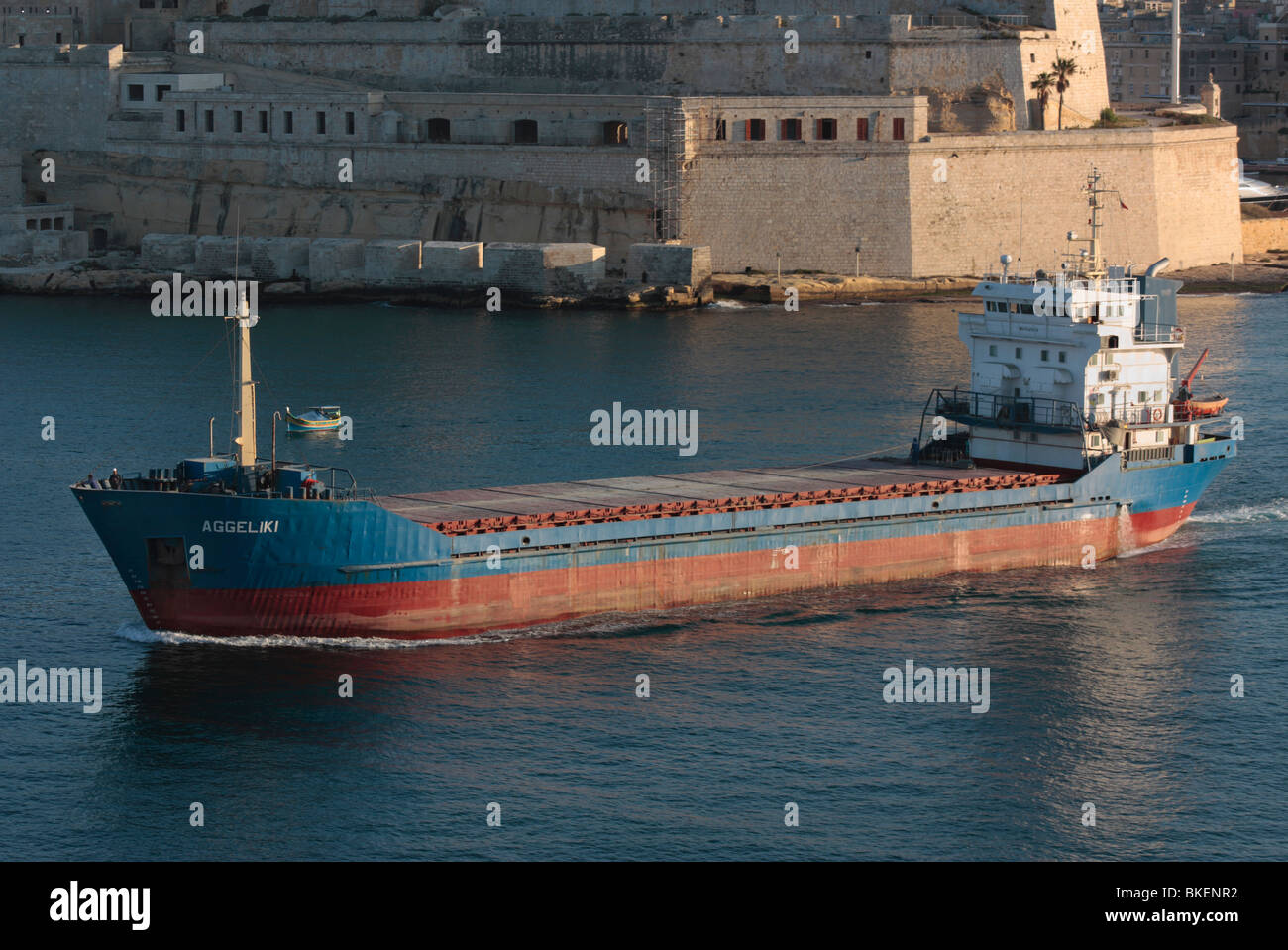 The cargo ship Aggeliki sailing out of Malta's Grand Harbour Stock ...