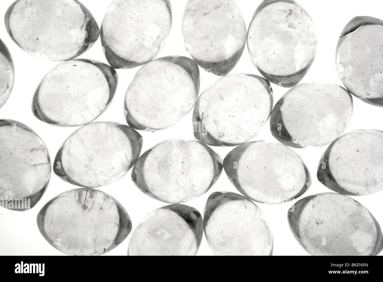 Glass transparent oval marbles over white background Stock Photo - Alamy