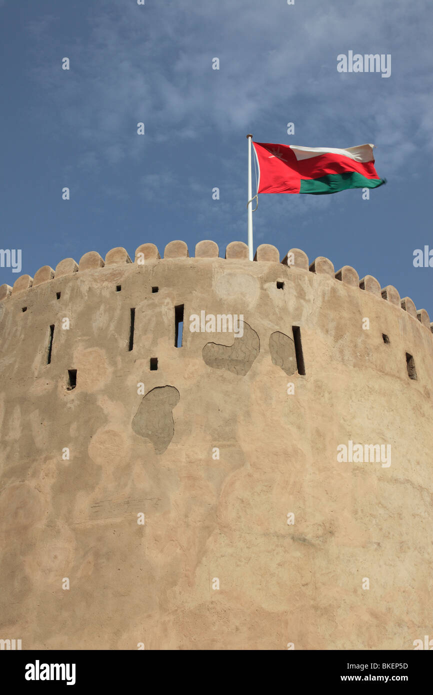 national Omani flag on the tower of the fort in Bidbid, Sultanate of ...