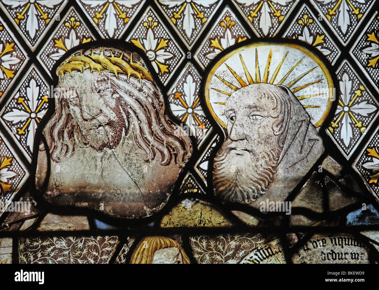 A Medieval stained glass window depicting Jesus with a crown of thorns ...