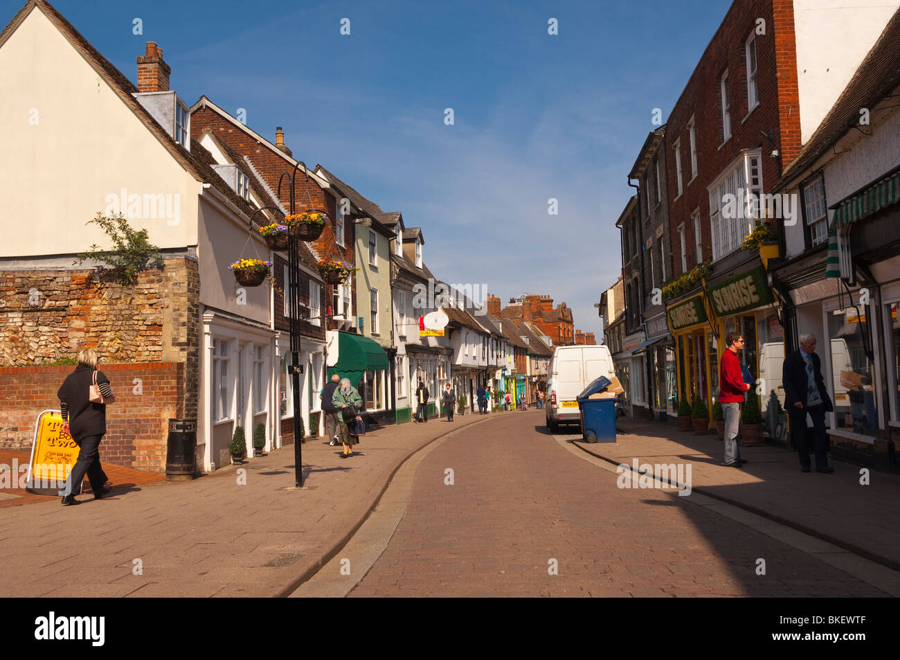 A pretty street with shoppers in Bury Saint Edmunds , Suffolk , England ...