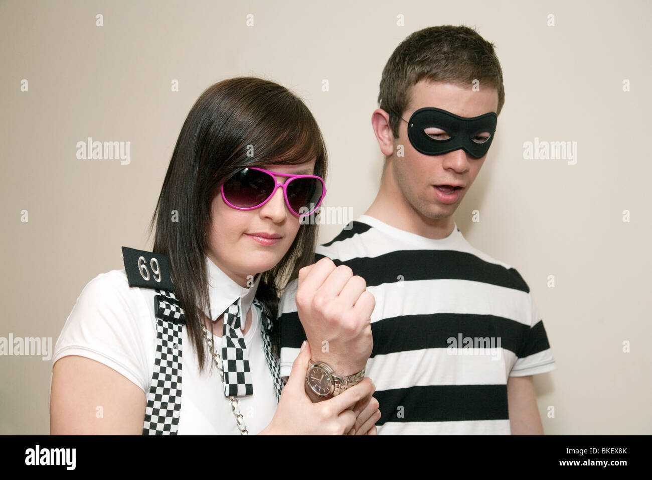 Two teenagers young couple dressed up to go to a fancy dress party, UK ...