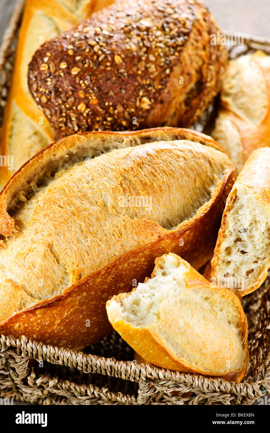 Various kinds of fresh baked bread in basket Stock Photo - Alamy
