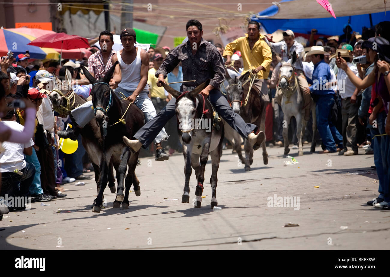 Participants ride donkeys at the 48th annual Donkey Festival in Otumba ...