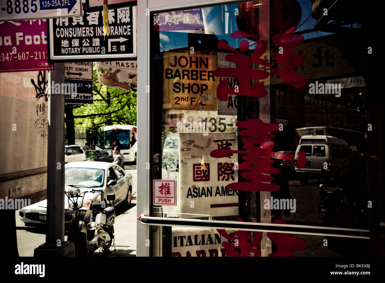 A barber shop window on 40th Avenue, Chinatown, Flushing, New York, USA ...
