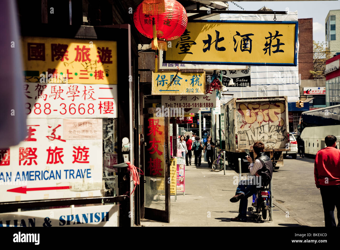 A busy street scene and Chinese shop signs on 40th Avenue, Chinatown ...