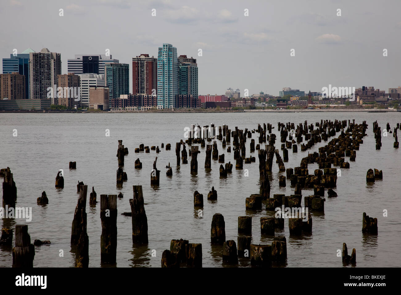 Old wooden pier supports in the Hudson River Pier 40 Manhattan New York ...