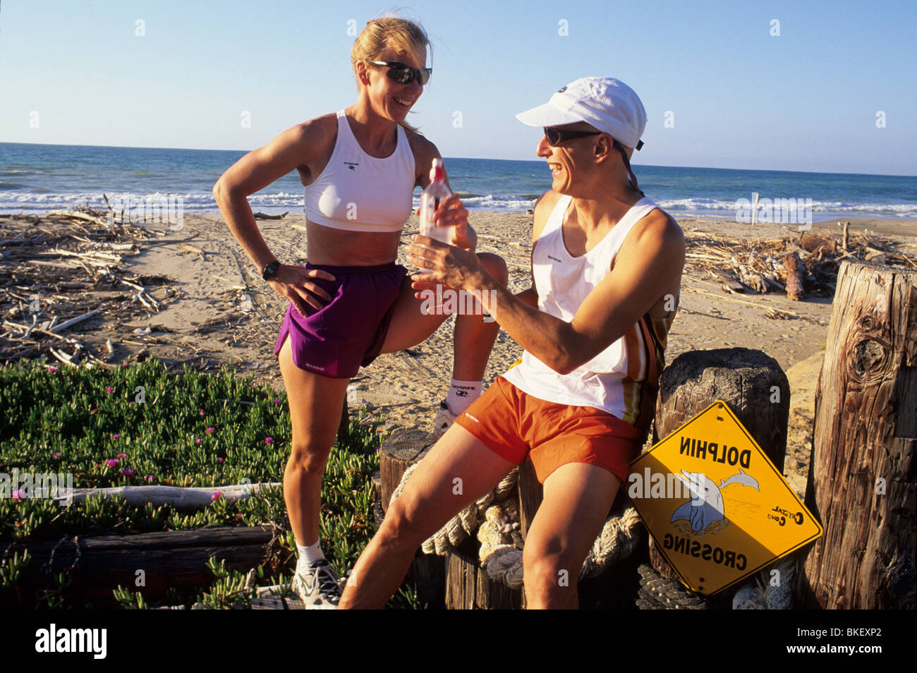 Couple stretching after run hi-res stock photography and images - Alamy