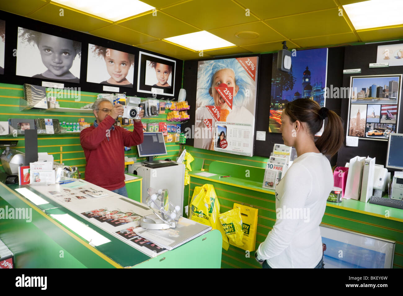 A teenage girl having her photo taken in Snappy Snaps photographers ...