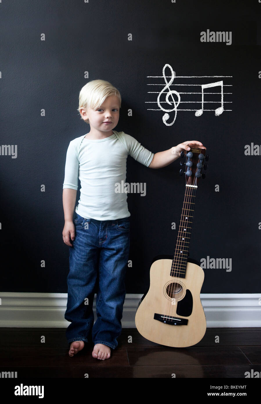 Young musician with acoustic guitar Stock Photo - Alamy