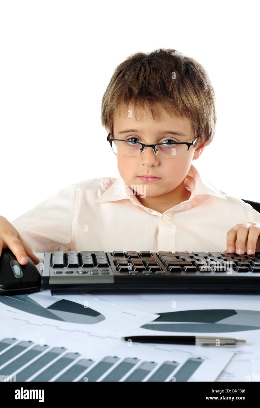 Vertical image of a young boy looking sad and fed up in his office ...
