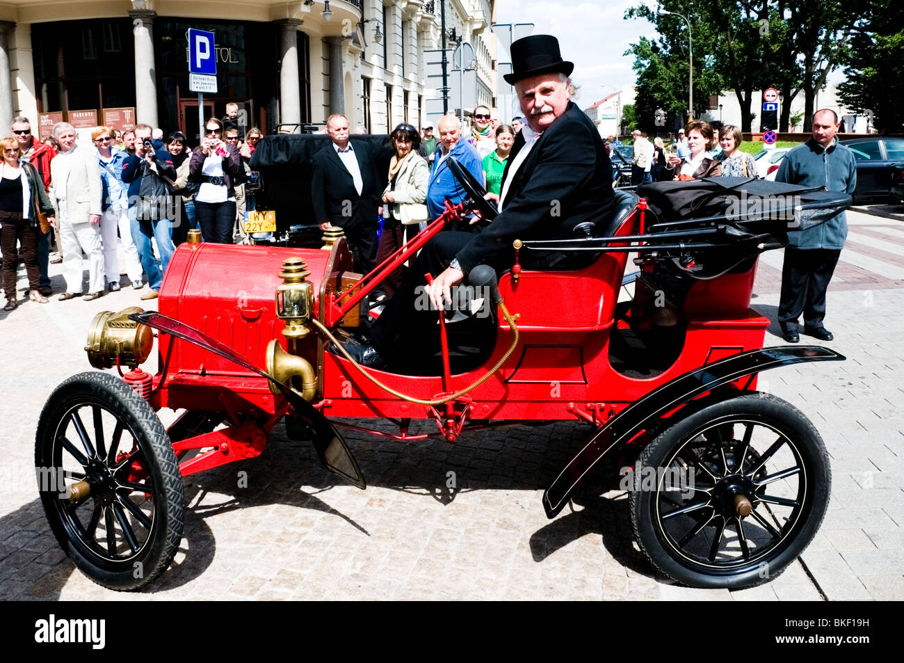 Polish man driving Vintage classic, red, open top car, close-up at ...