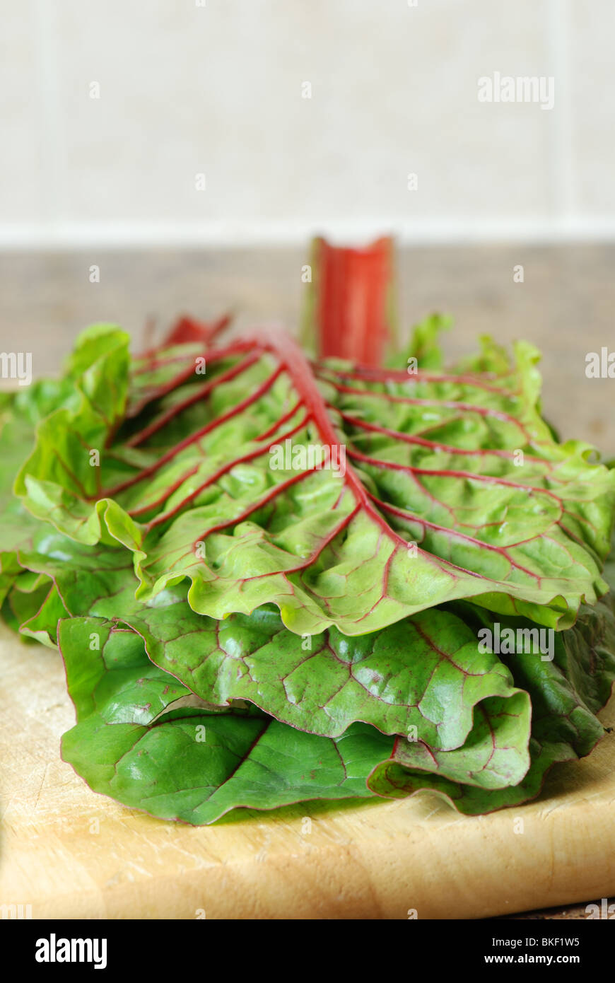 Red chard leaves on a cutting board Stock Photo - Alamy