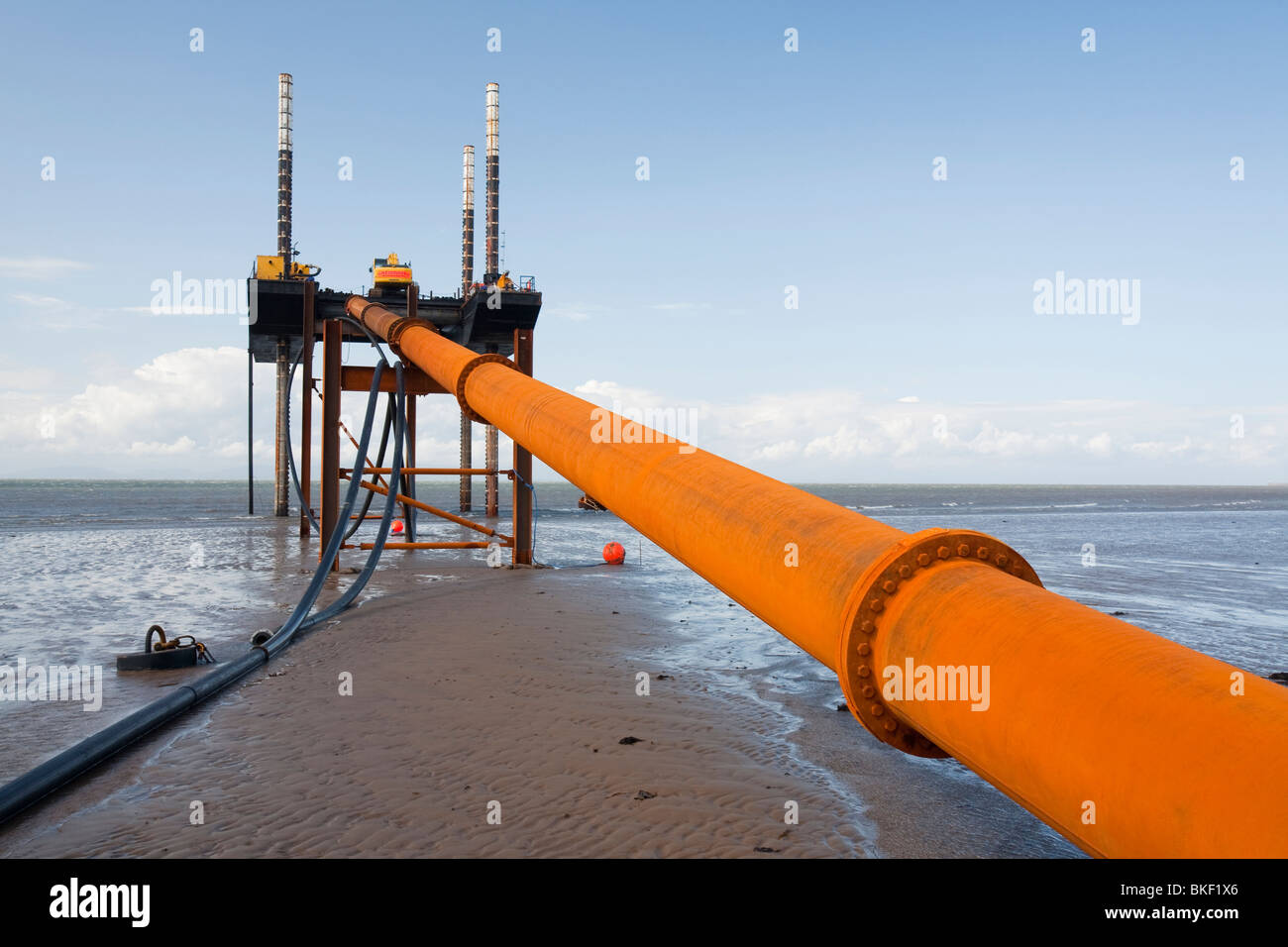 Laying the power cable from the Robin Rigg offshore wind farm in the ...