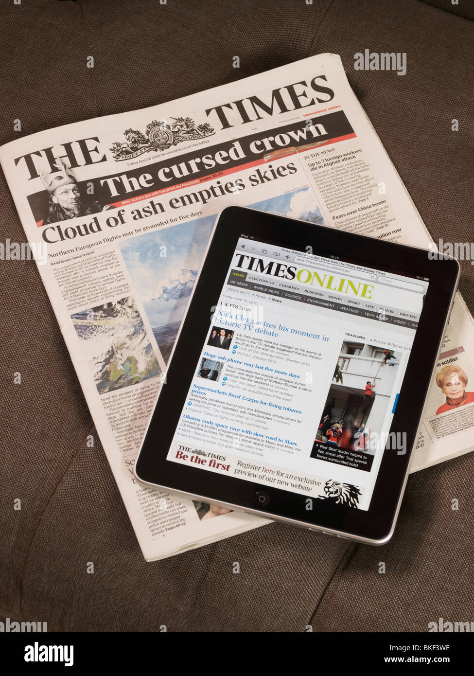 Apple iPad the new way to read news with Times newspaper Stock Photo ...