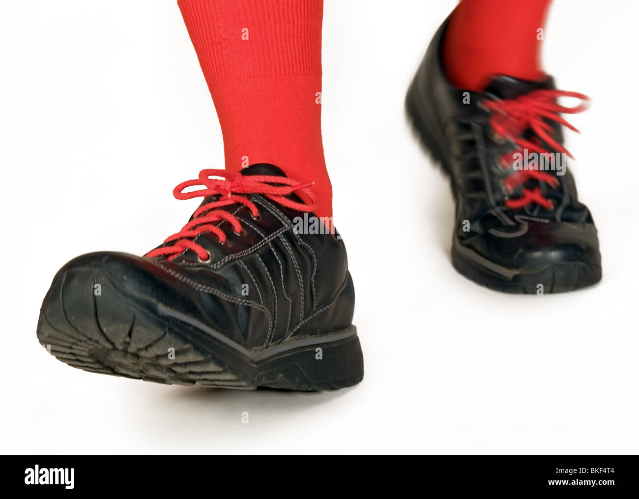 walking black shoes with red sock Stock Photo - Alamy