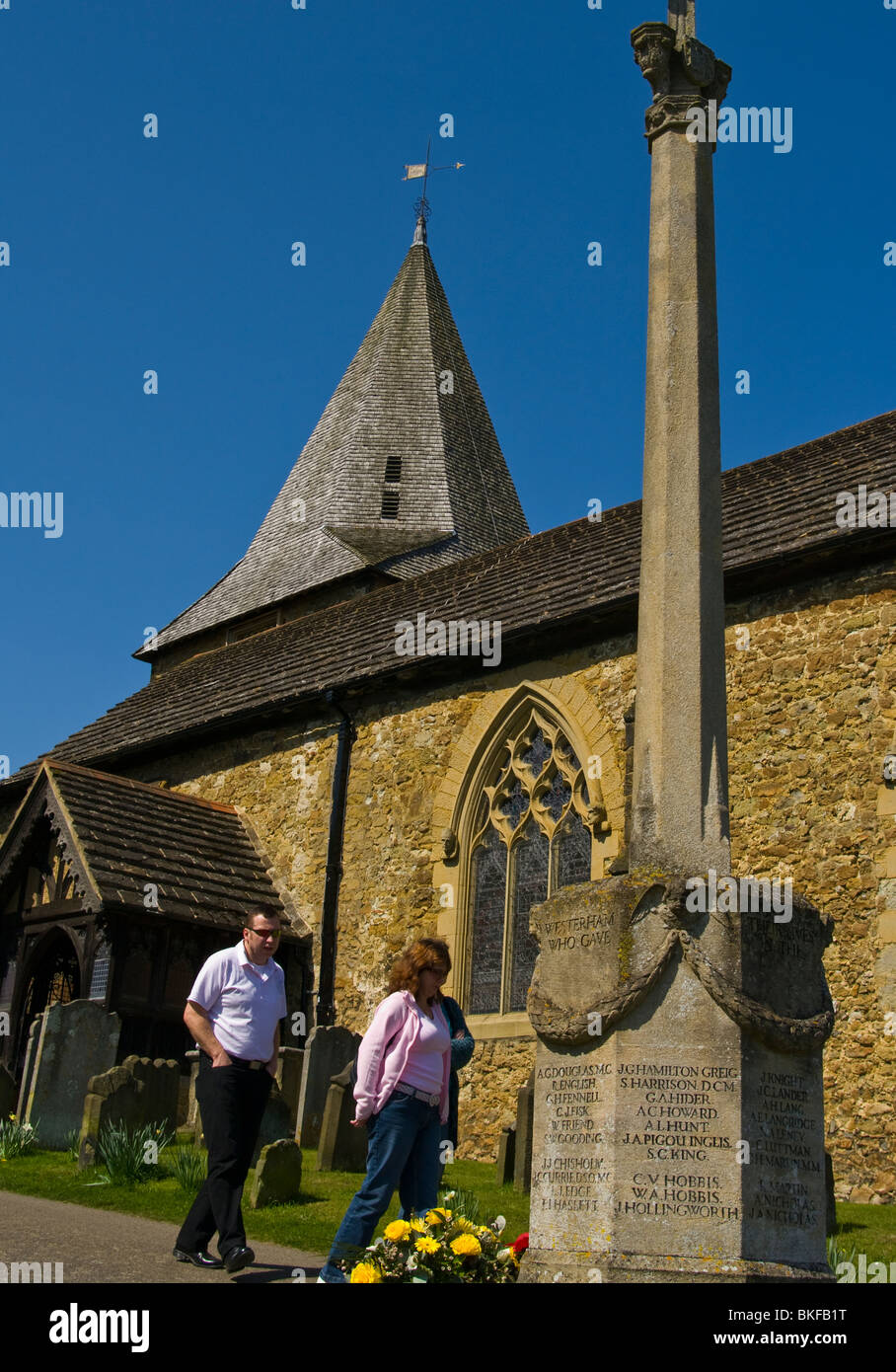 People Walking By The War Memorial at St Mary The Virgin C Of E Church ...