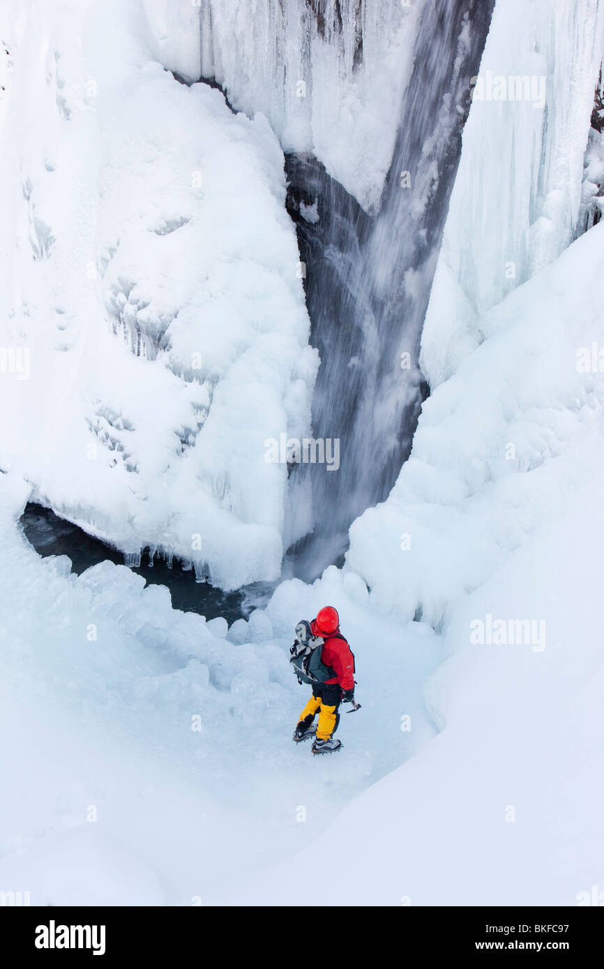 The mountaineer, Mike Withers ice climbing in Fisher Place gill above ...
