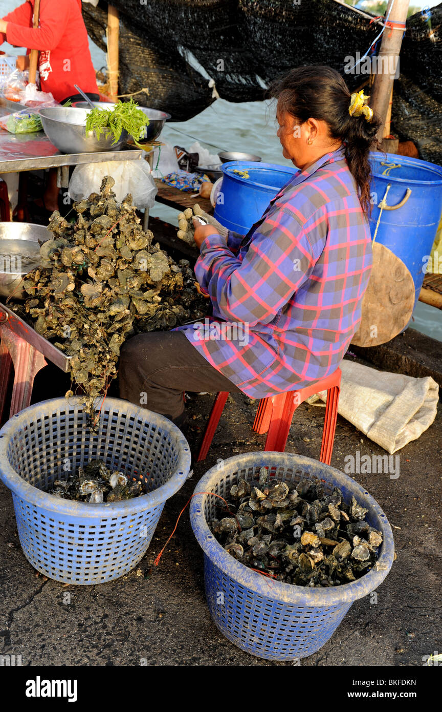 freshly caught oysters being cleaned at Ang Sila, fishing village and ...