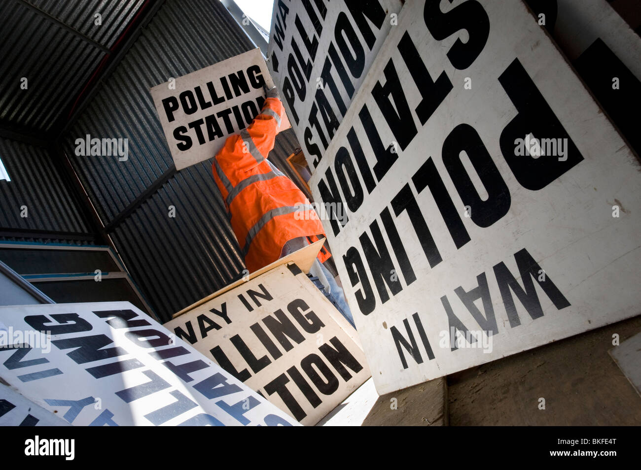 A council official sorts through 100's of polling signs and booths in ...