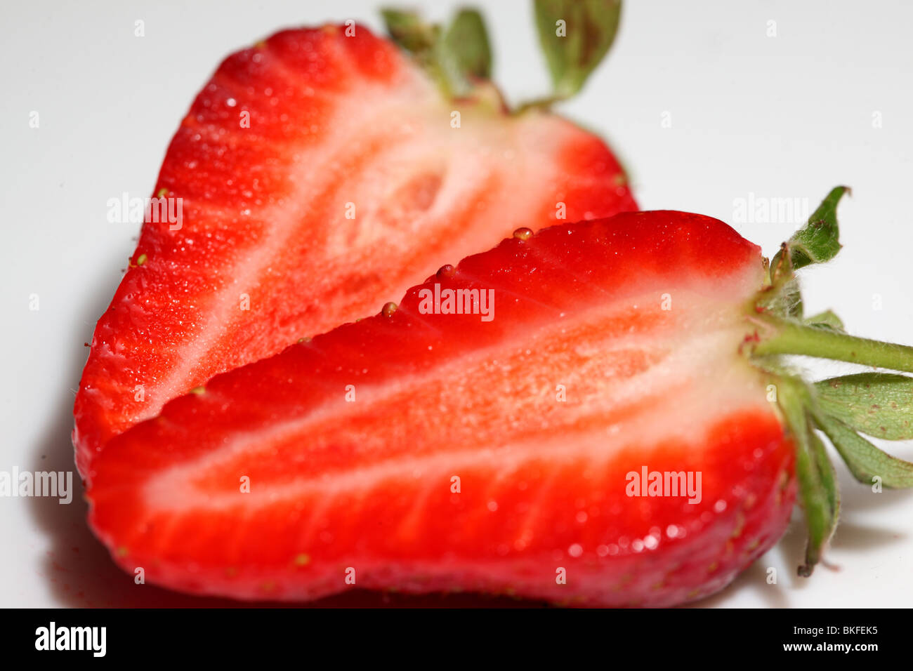 Strawberry cut in half hi-res stock photography and images - Alamy