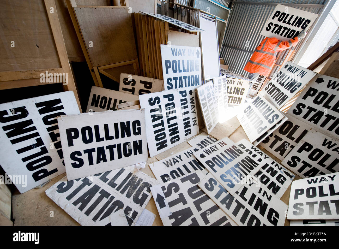 A council official sorts through 100's of polling signs and booths in ...
