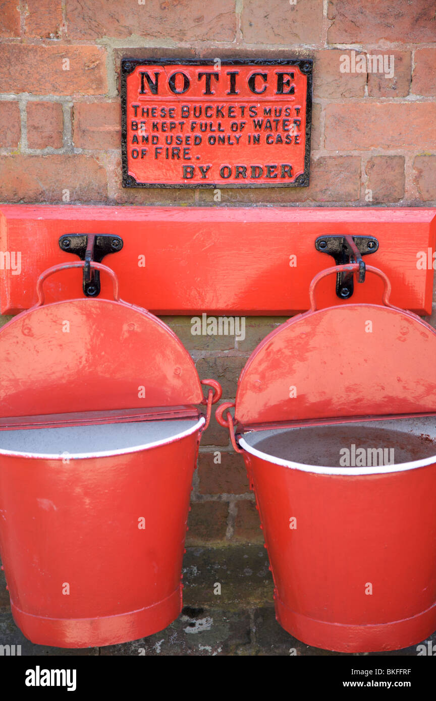 Two Red Fire Buckets on a Stand Stock Photo - Alamy
