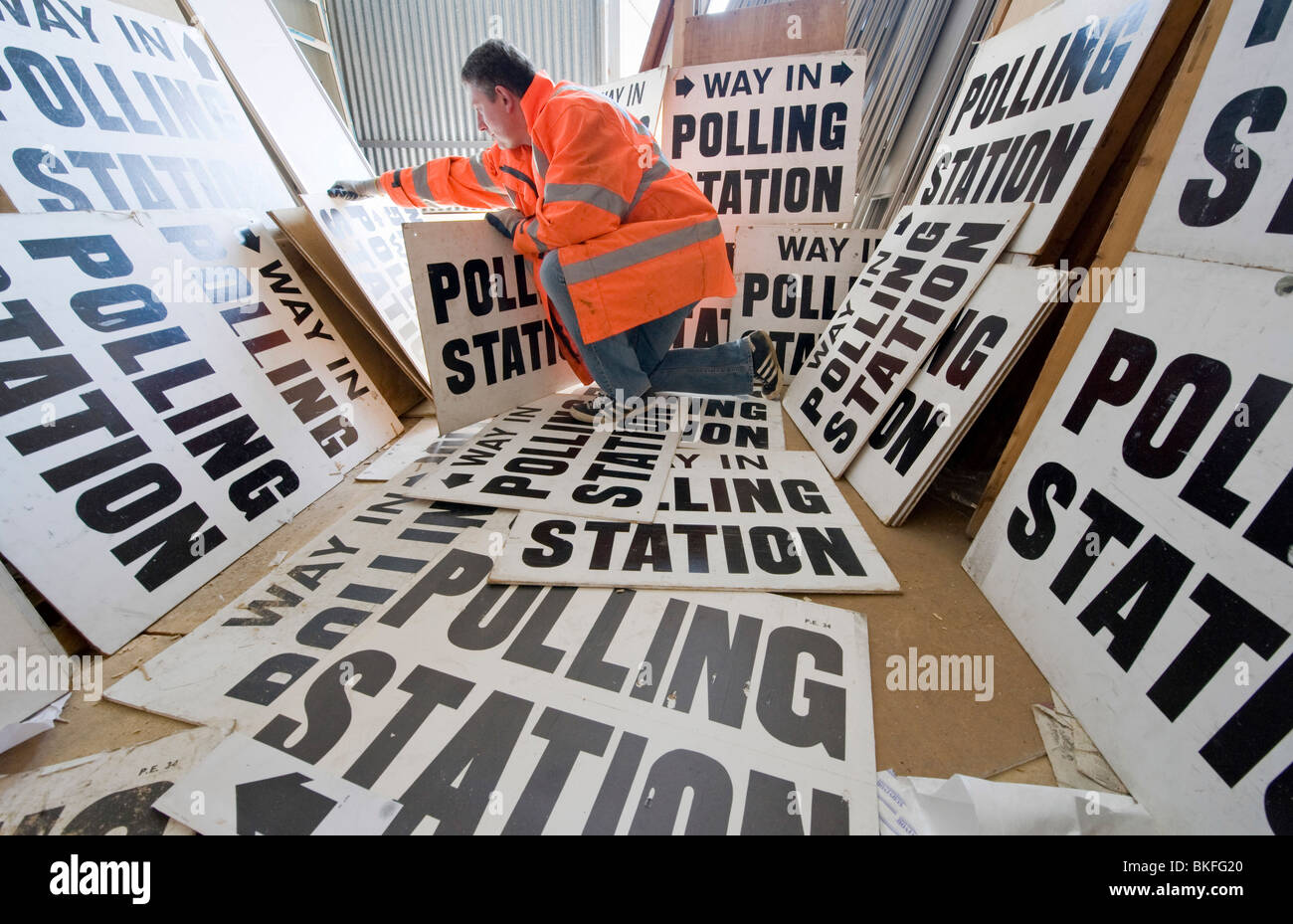 A council official sorts through 100's of polling signs and booths in ...