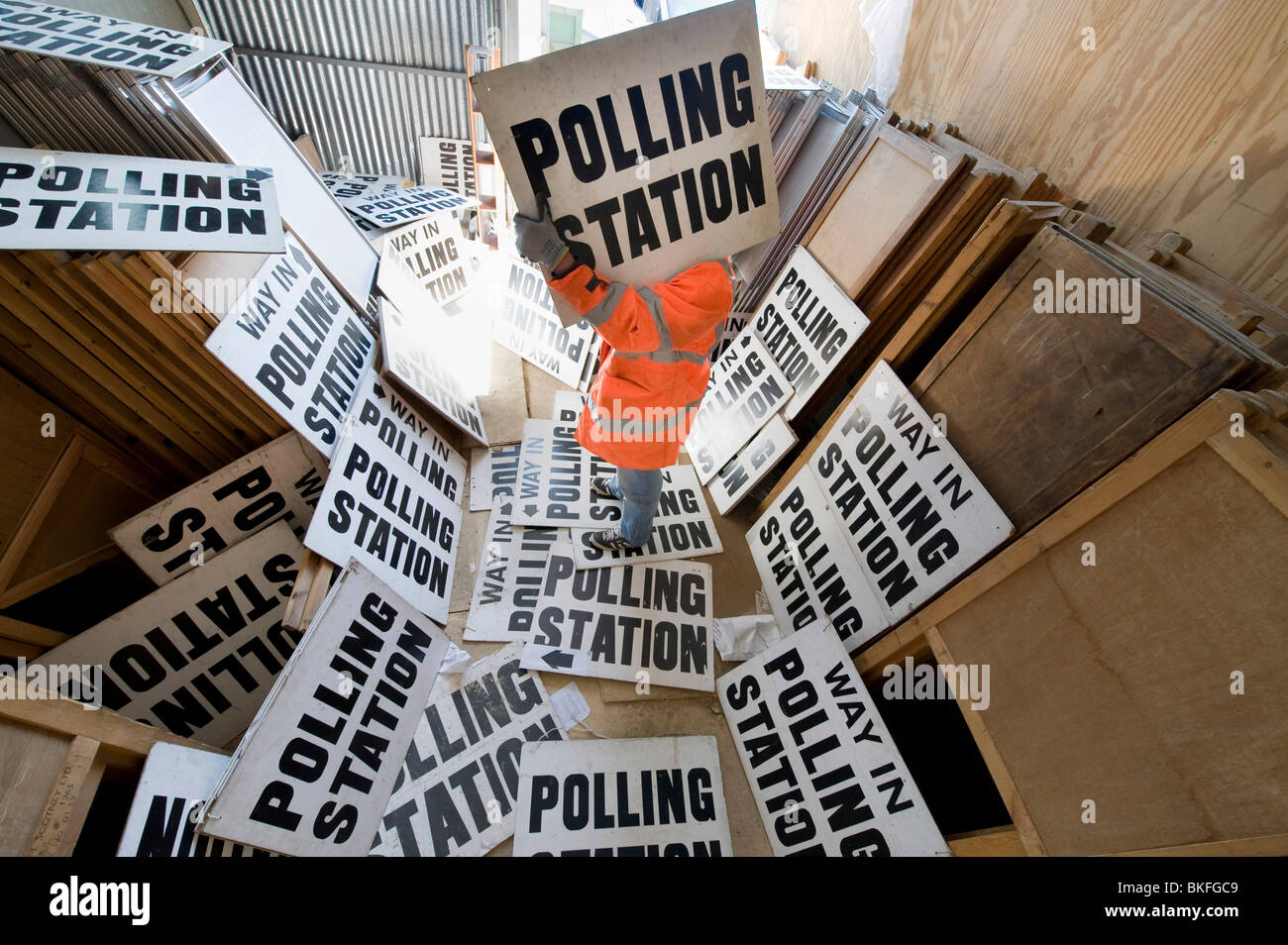 A council official sorts through 100's of polling signs and booths in ...