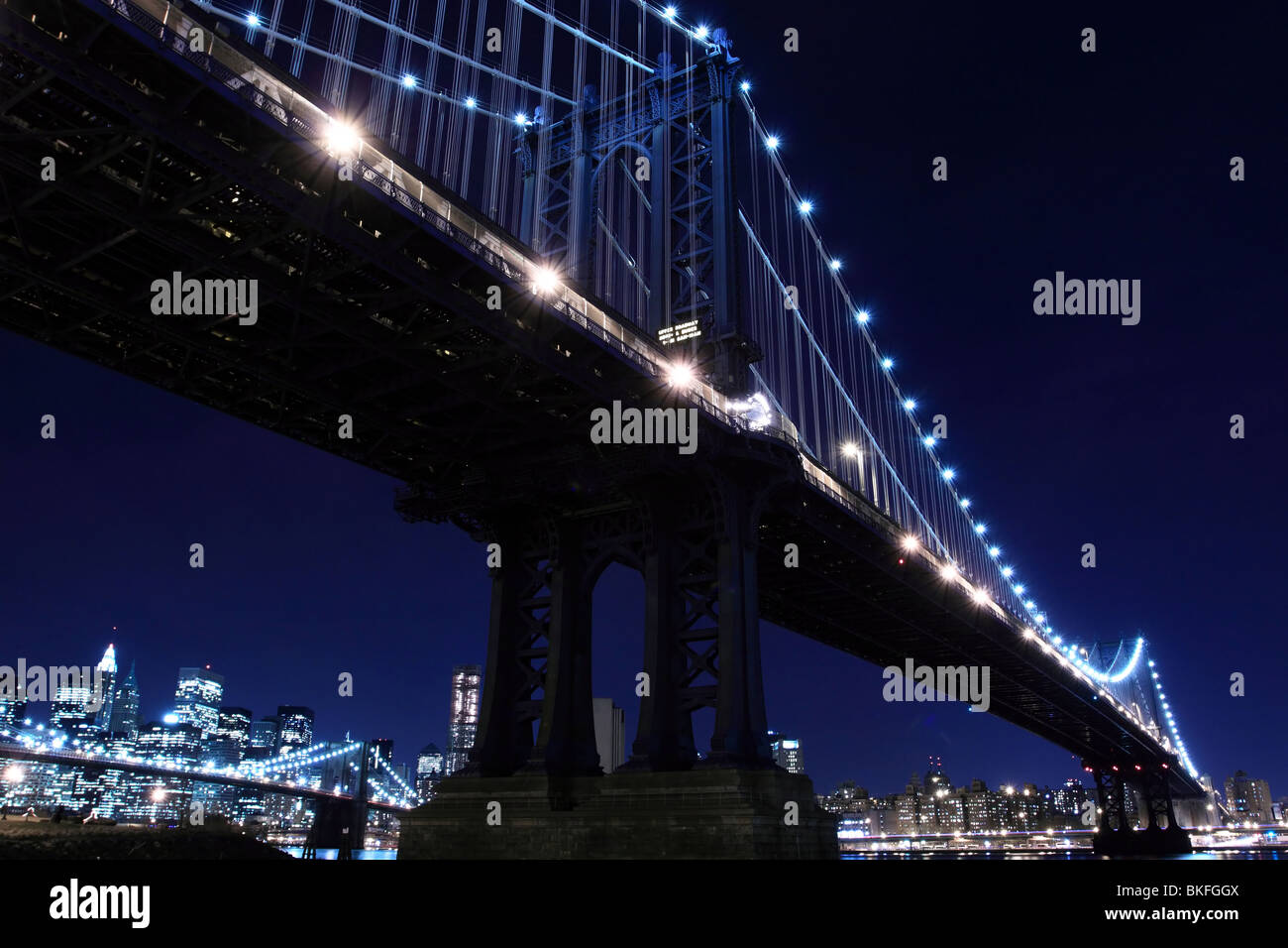 New York City Skyline and Manhattan Bridge At Night Stock Photo - Alamy
