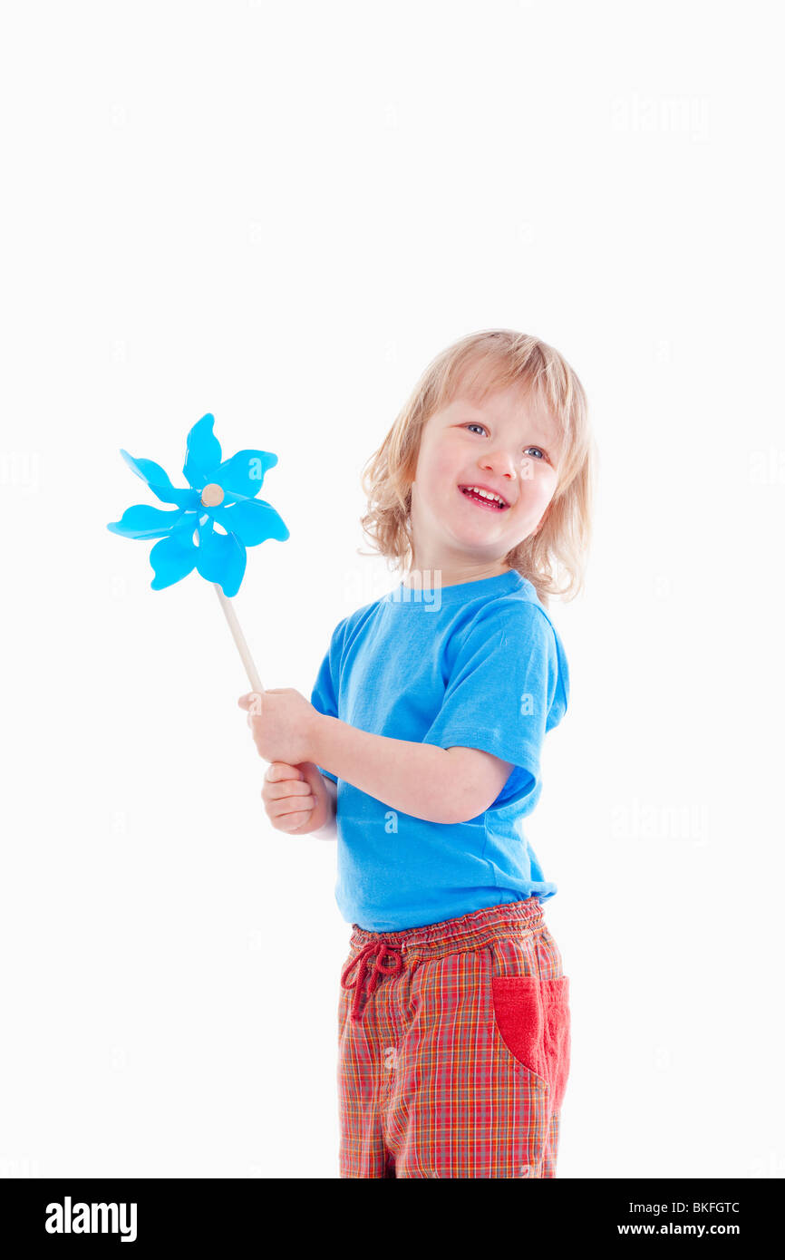 studio shot of a boy playing with pinwheel - isolated on white Stock ...