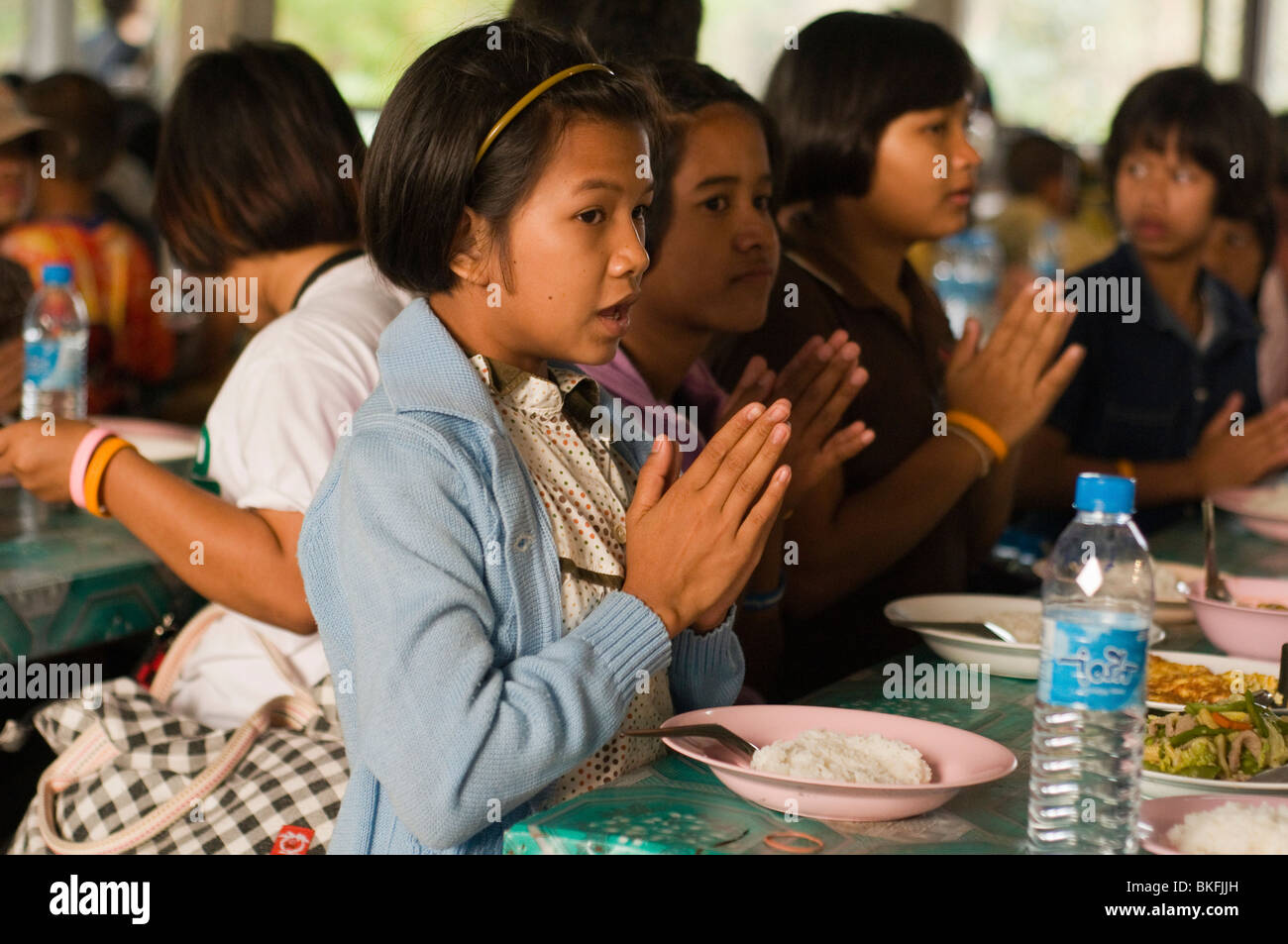 Thai children giving thanks before a meal Stock Photo - Alamy