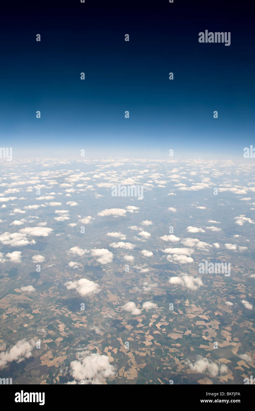 the sky and earth from above taken from an airplane window Stock Photo ...