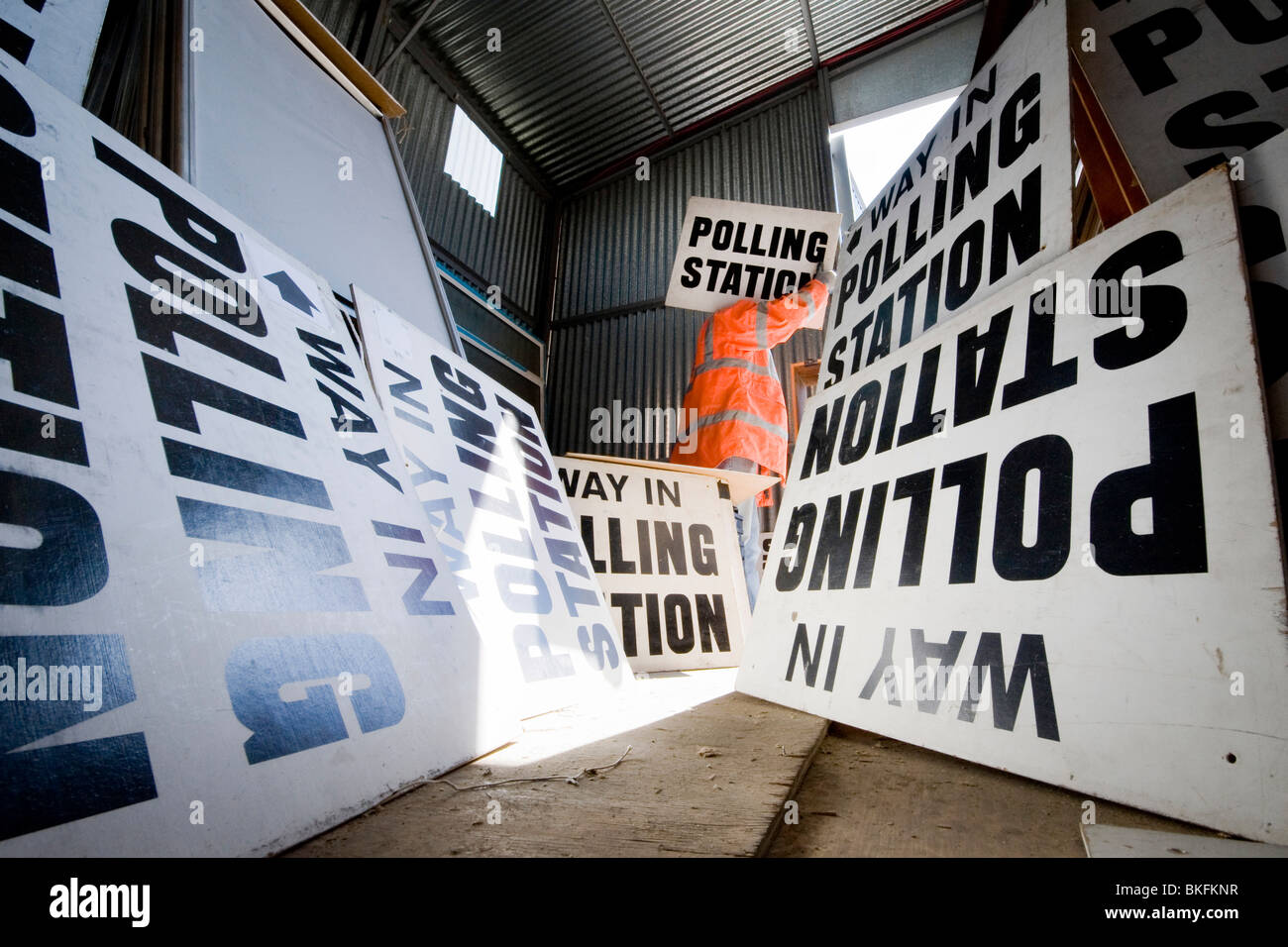 A council official sorts through 100's of polling signs and booths in ...